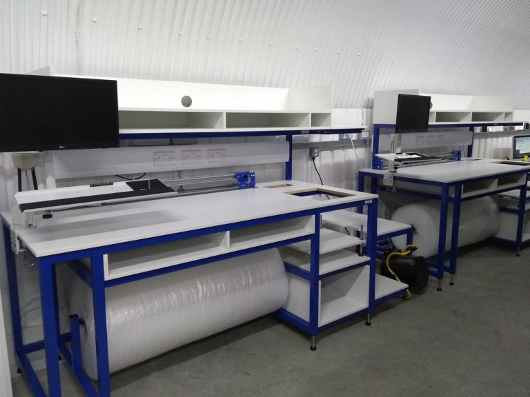 Packing stations with storage shelving - Spaceguard